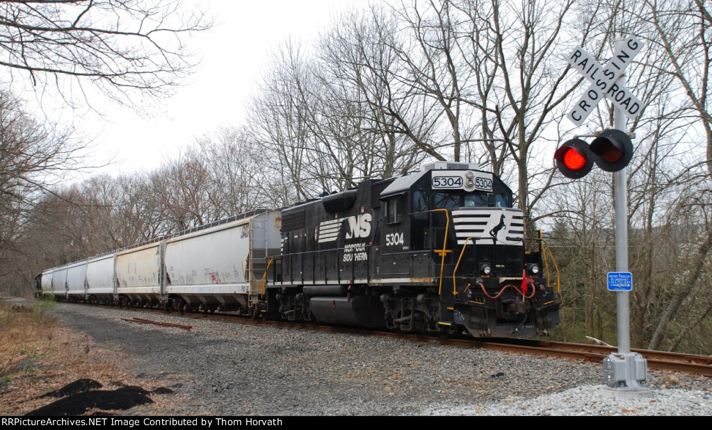 NS 5304 brings up the rear marker on D&DR's RP-1 at Mill Pond grade crossing